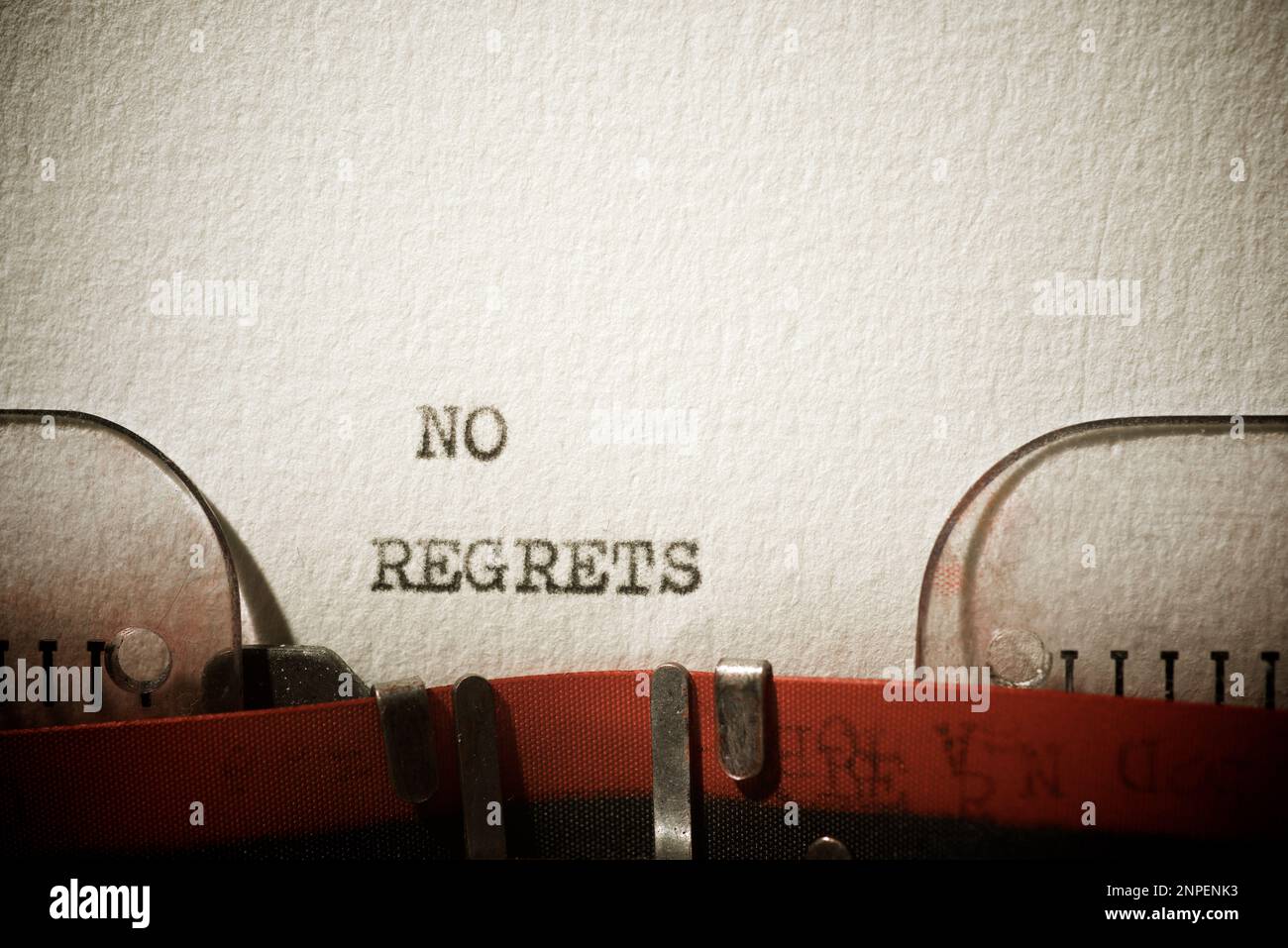 No regrets text written with a typewriter Stock Photo - Alamy