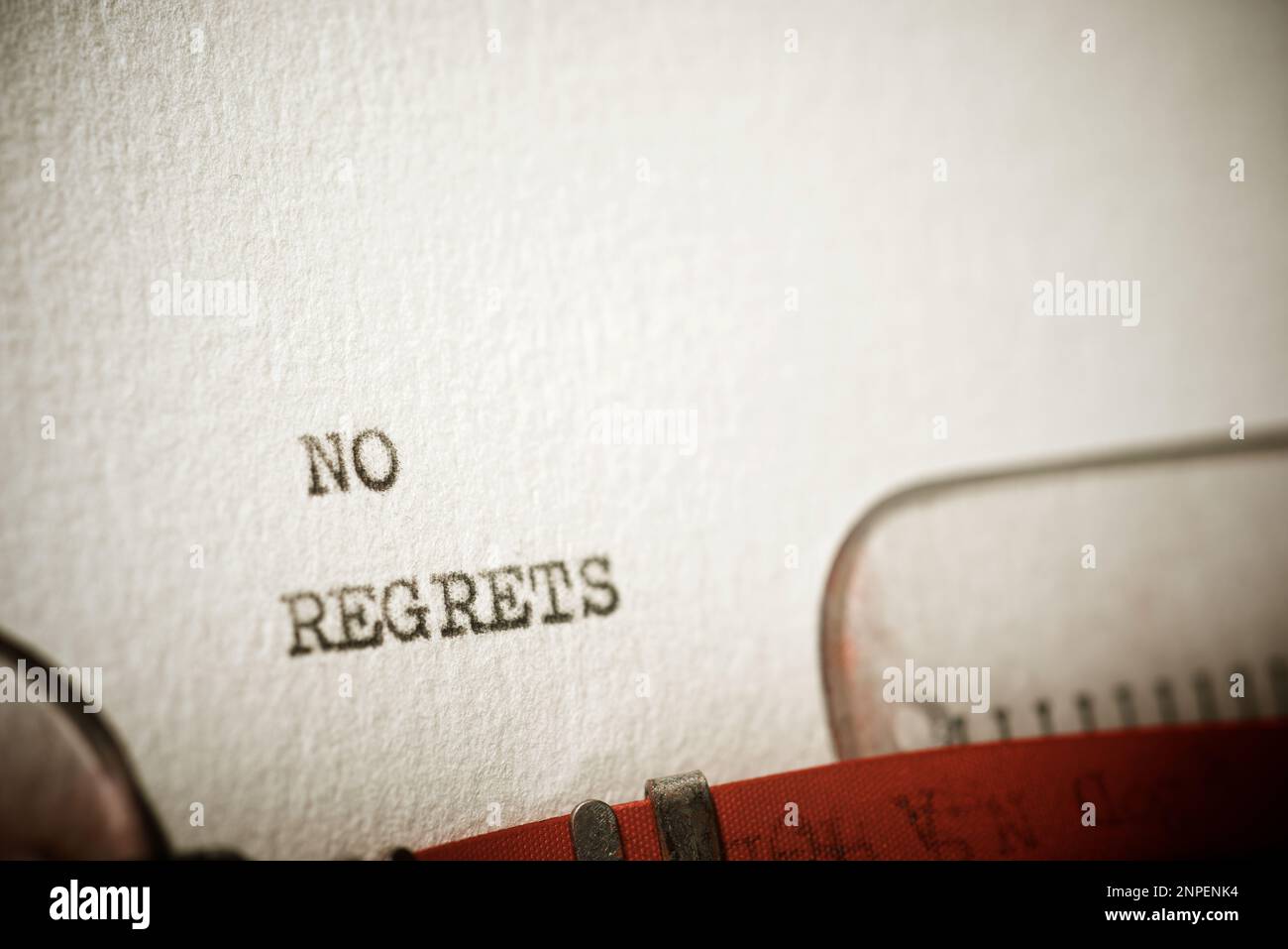 No regrets text written with a typewriter Stock Photo - Alamy