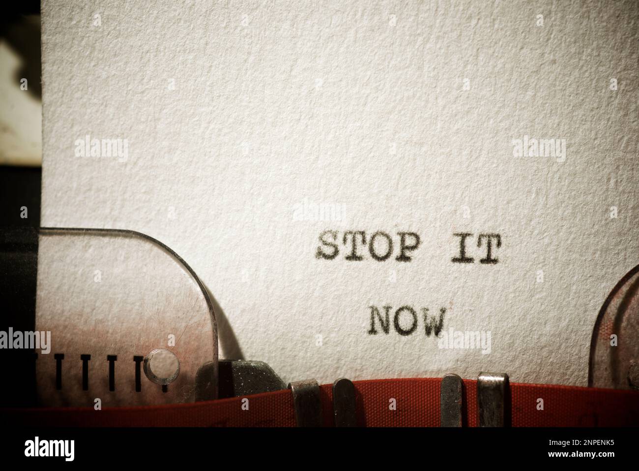 Stop it now text written with a typewriter Stock Photo - Alamy