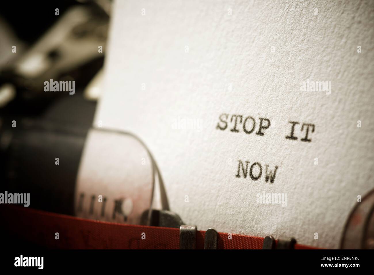 Stop it now text written with a typewriter Stock Photo - Alamy