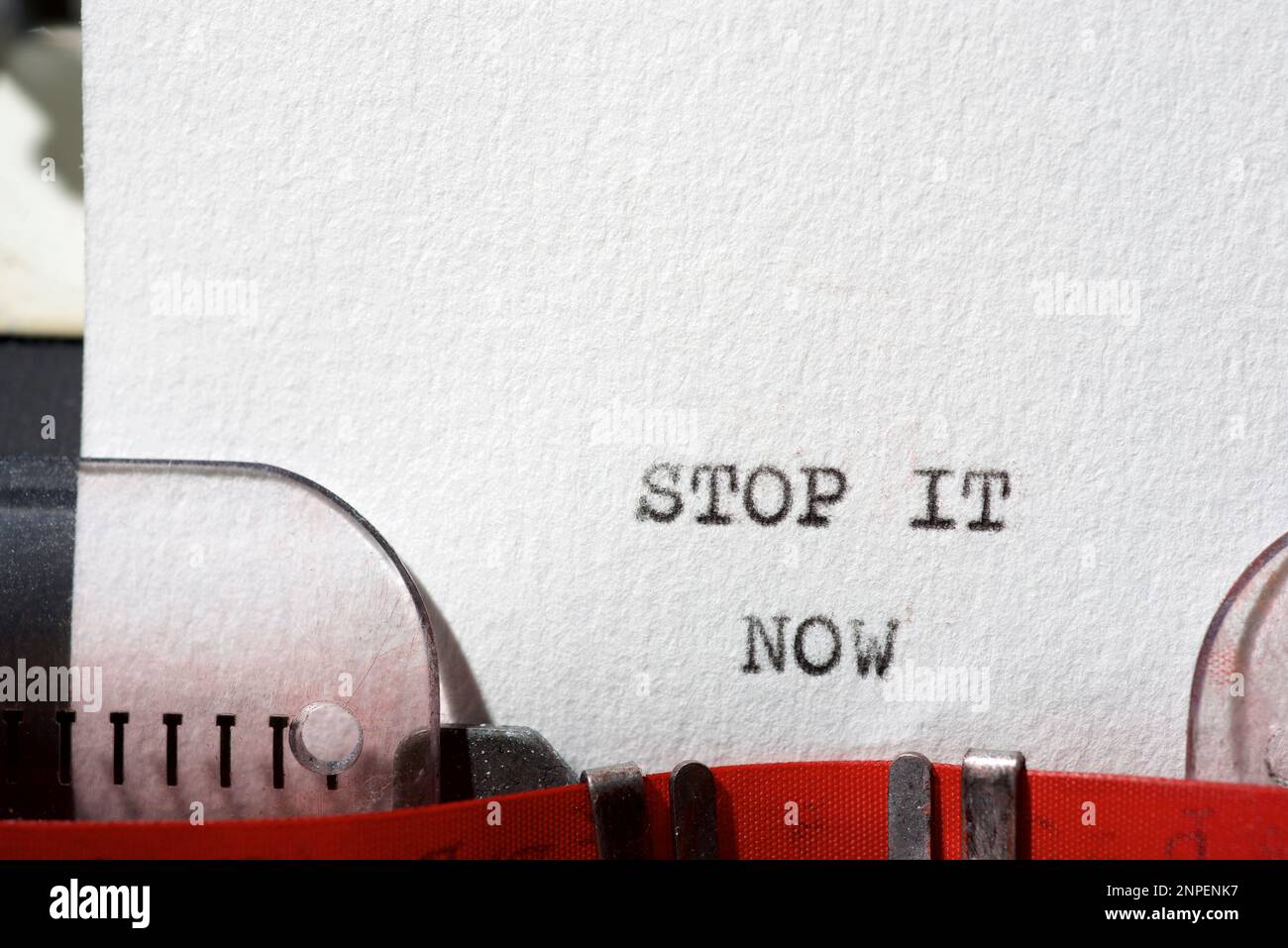 Stop it now text written with a typewriter Stock Photo - Alamy