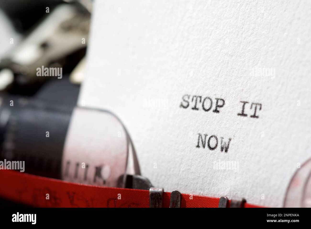 Stop it now text written with a typewriter Stock Photo - Alamy