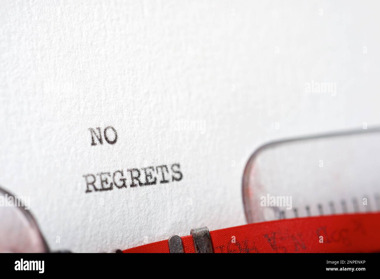No regrets text written with a typewriter Stock Photo - Alamy