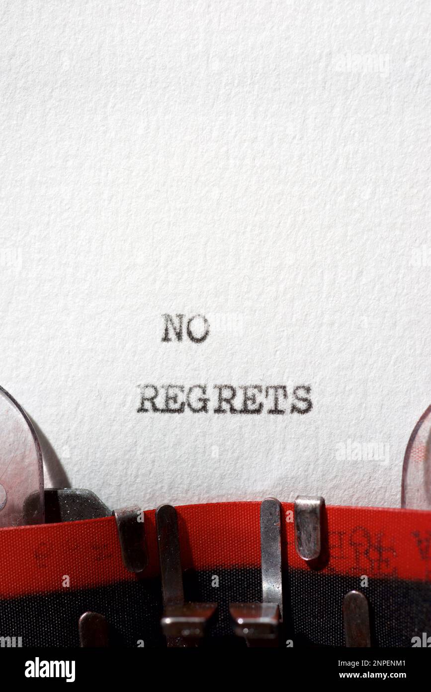 No regrets text written with a typewriter Stock Photo - Alamy