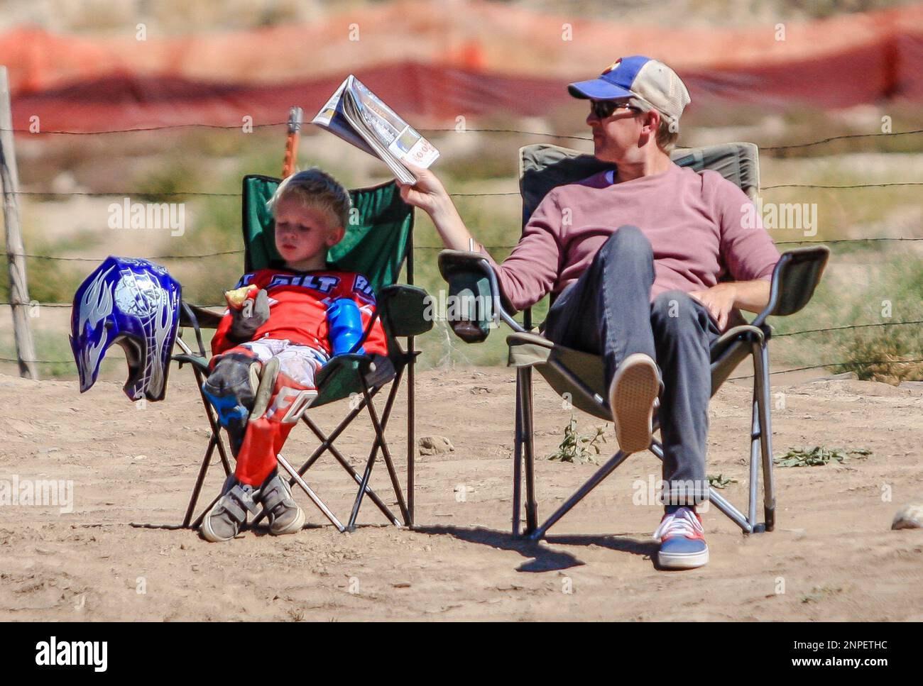 Matt McGovern of Centennial, Colo., shades Kieran, 7, during the ECBMX ...