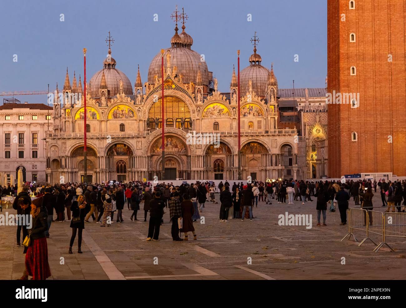 Crowds flocks to St Marks Square at twilight during Carnival at Venice ...