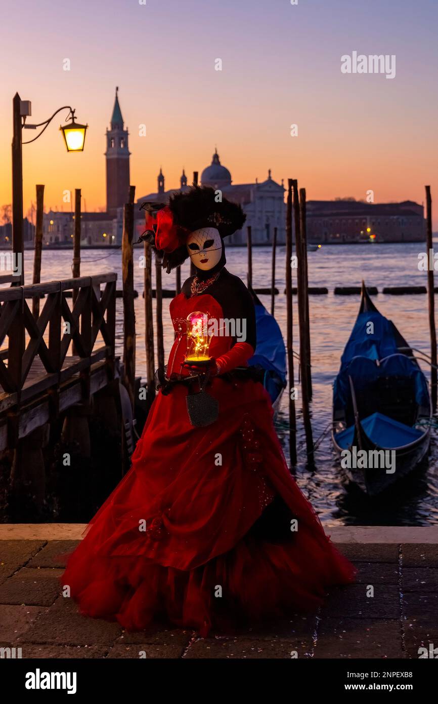 Carnival goer dressed in splendid costume and mask during Venice ...