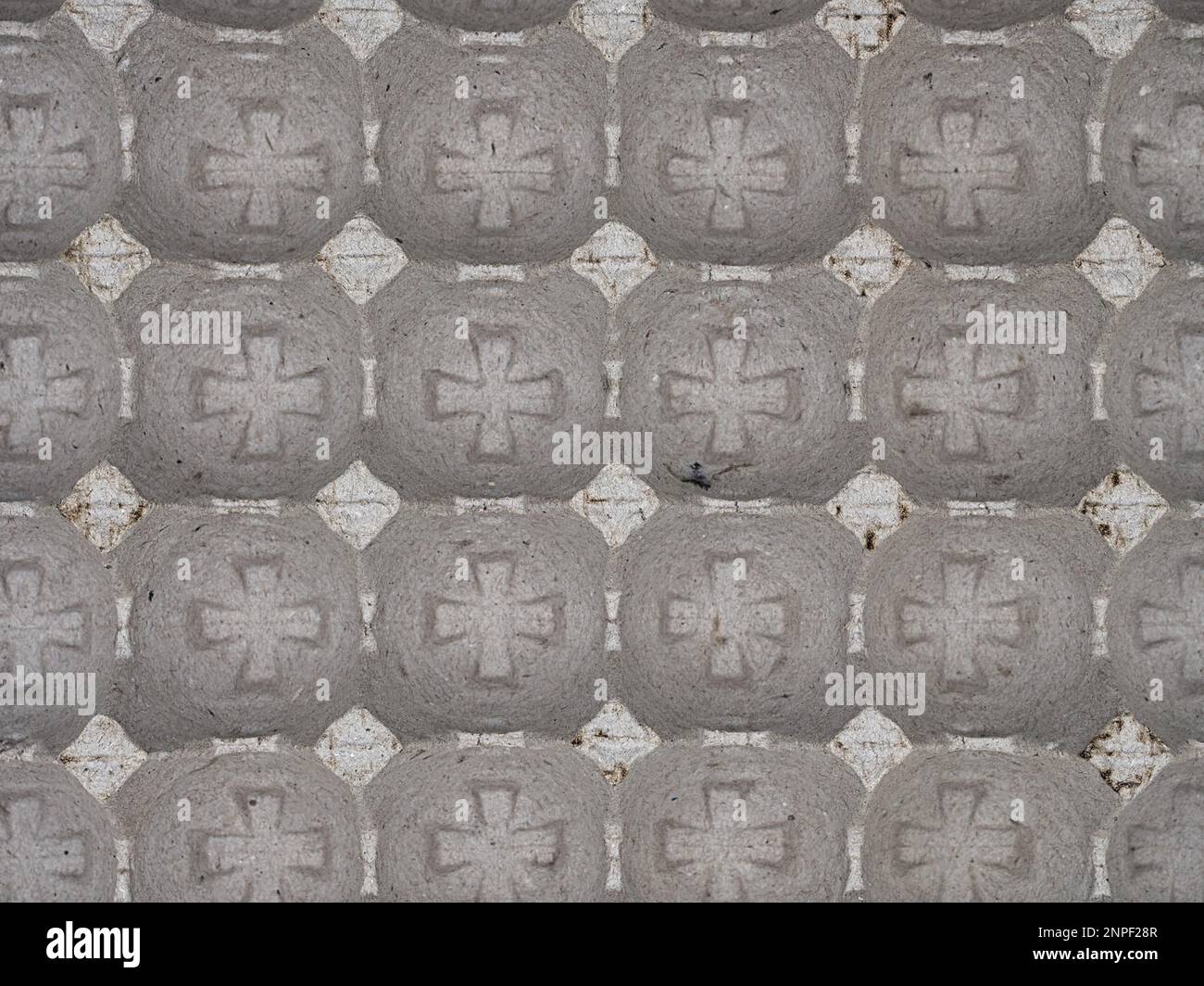 Overhead angle of a large egg crate. The container has cross patterns ...