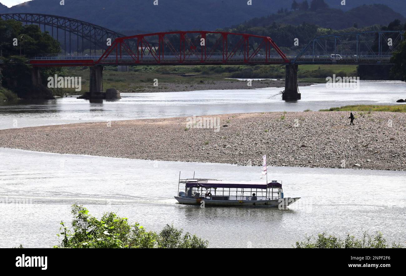 A houseboat moves along Abukuma River during a boating trip in Matumori ...