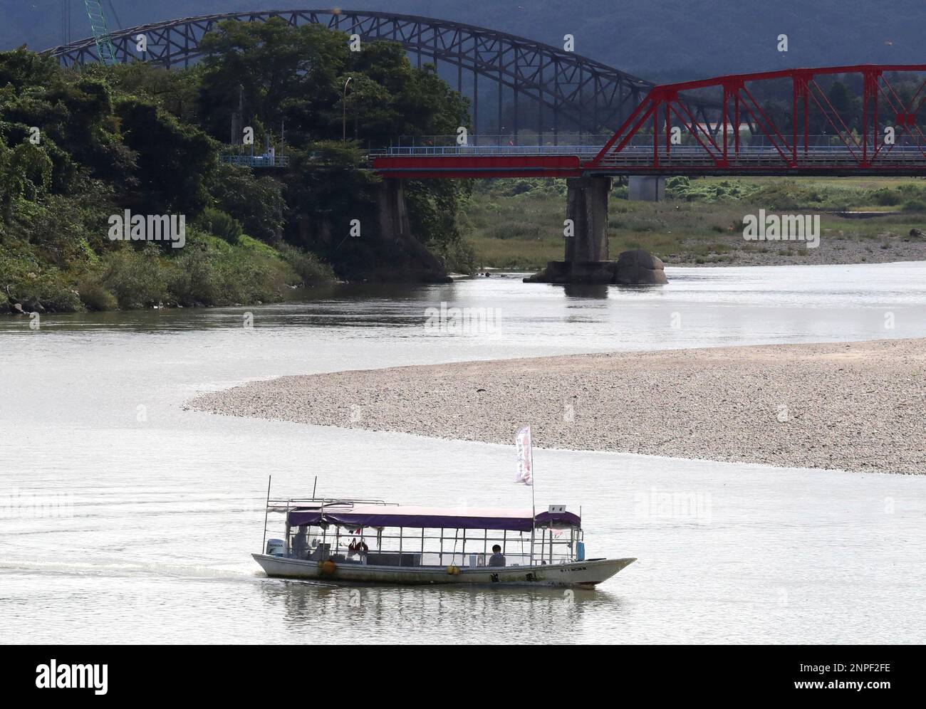 A houseboat moves along Abukuma River during a boating trip in Matumori ...