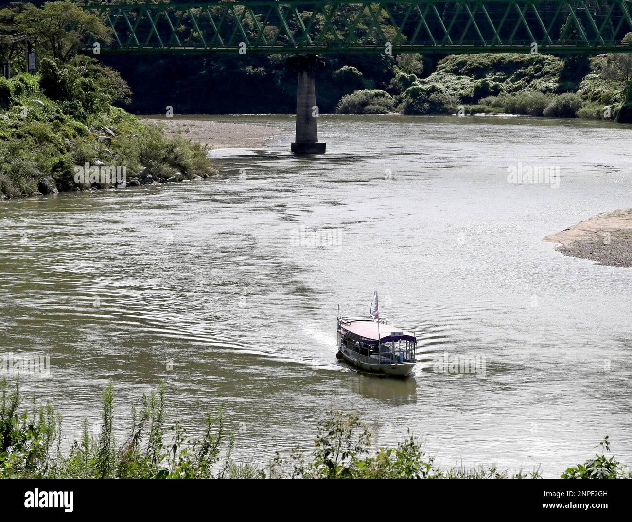 A houseboat moves along Abukuma River during a boating trip in Matumori ...