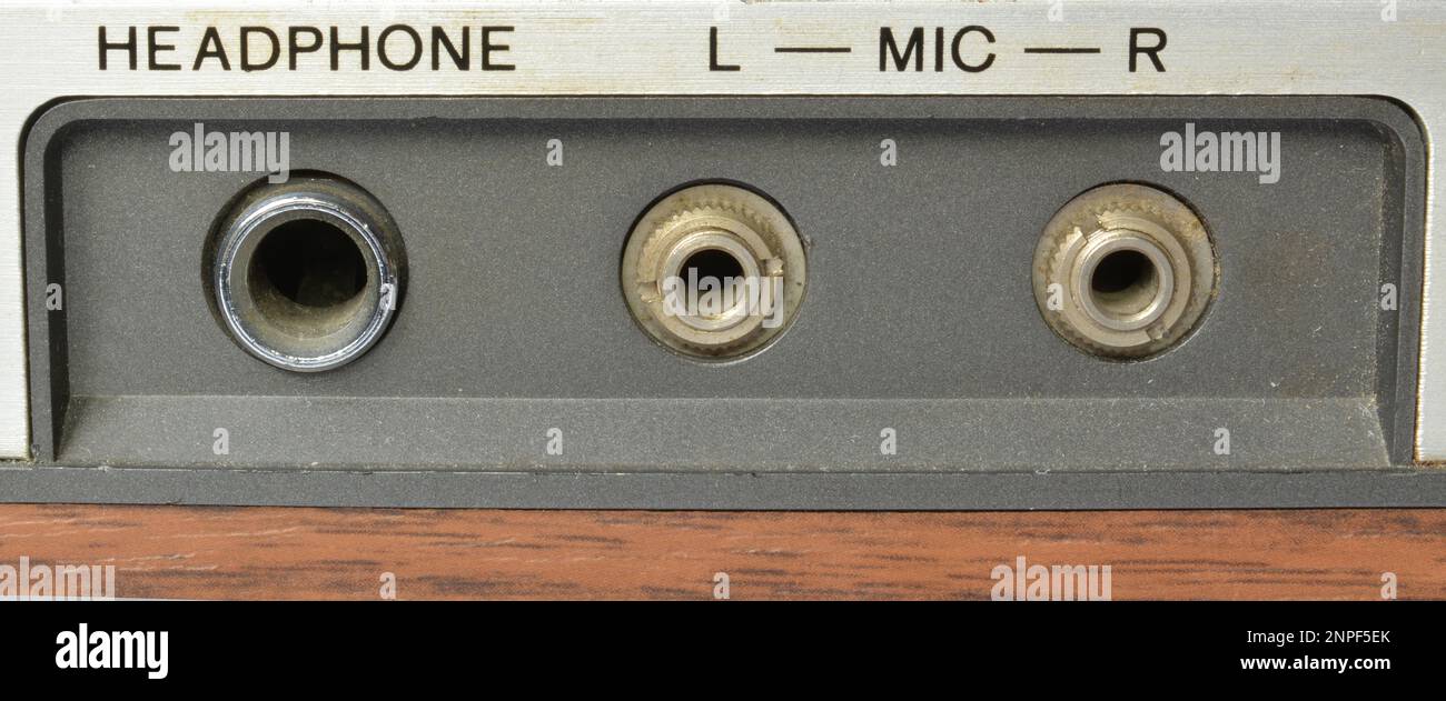 An auxiliary port for headphone and microphone on vintage tape recorder ...