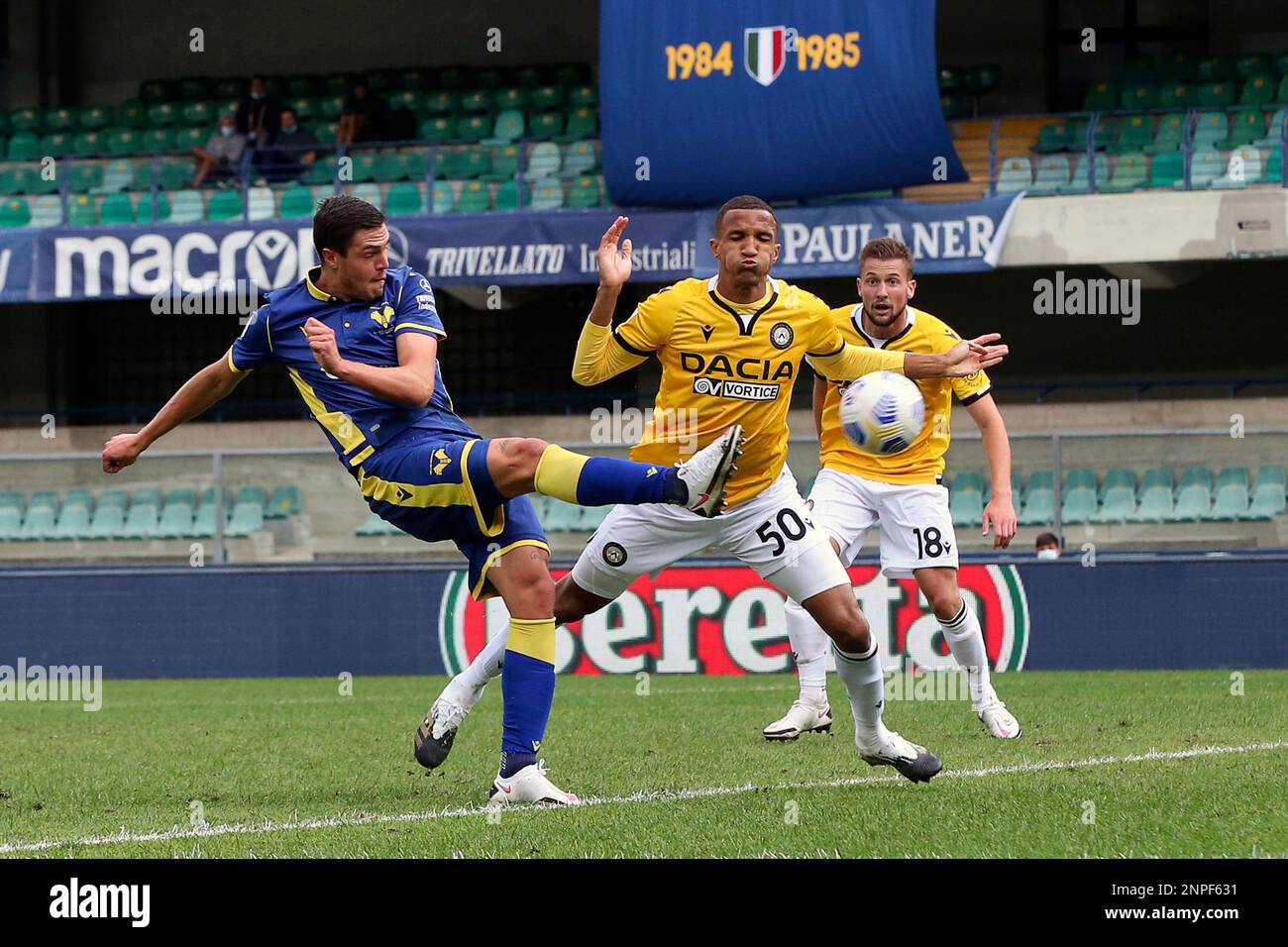 Verona’s Andrea Favilli, left, shoots to score during a Serie A soccer ...