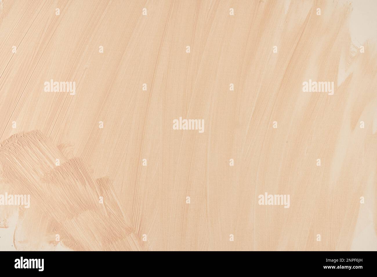 The beige texture draws a horizontal surface with space to copy ...