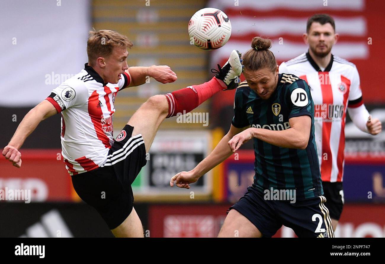 Sheffield United's Ben Osborn, left, challenges Leeds United's Luke ...
