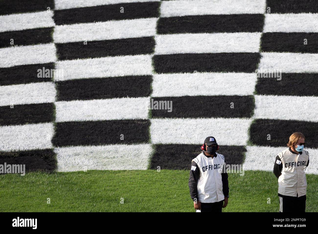 Race officials wear masks, a requirement from NASCAR to reduce the ...