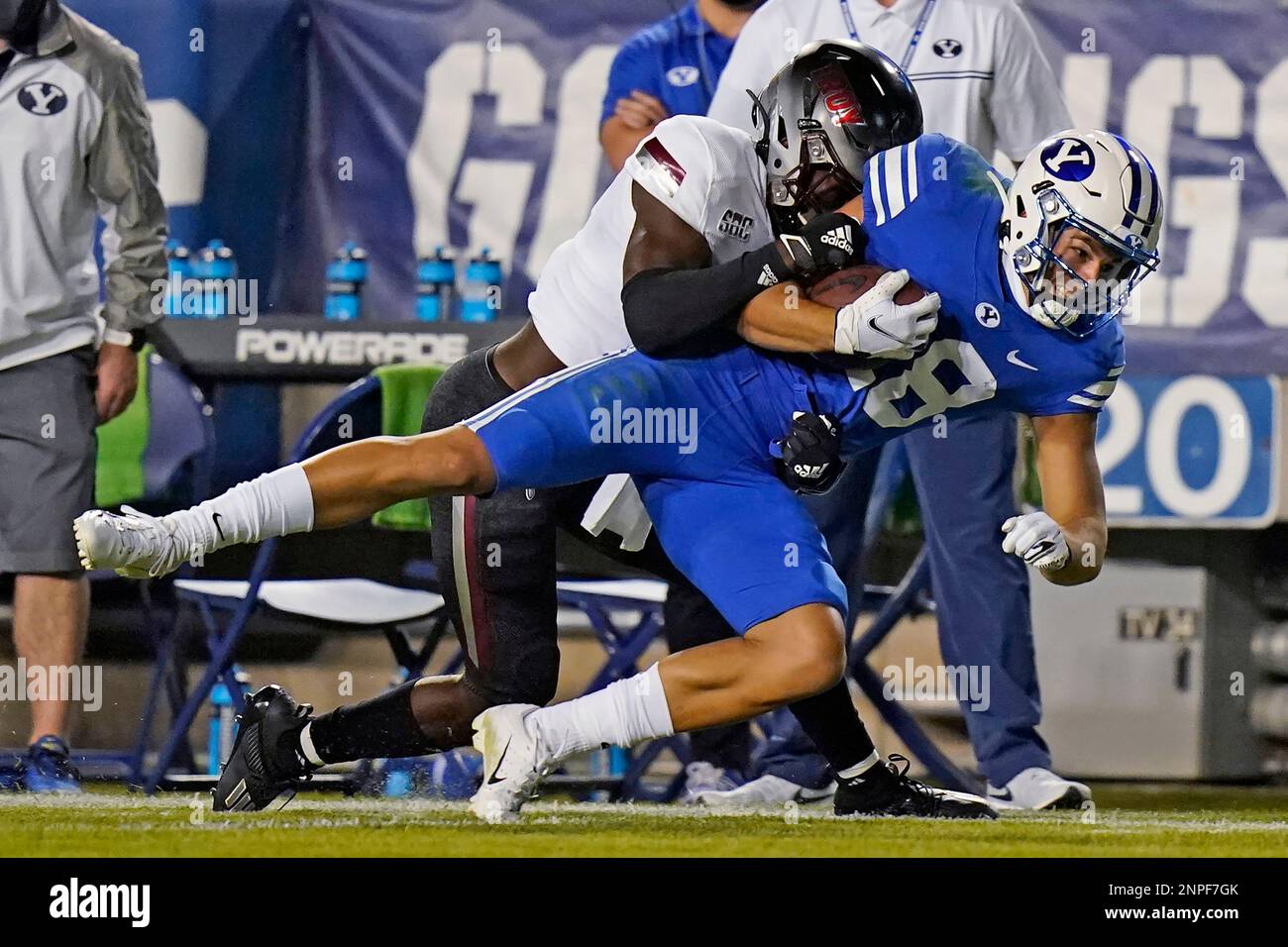 Troy safety Dell Pettus (31) tackles BYU wide receiver Gunner Romney ...