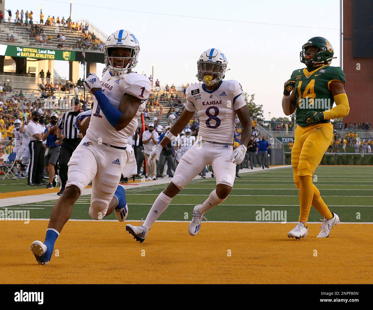 Kansas running back Pooka Williams Jr. (1) scores a touch down against ...