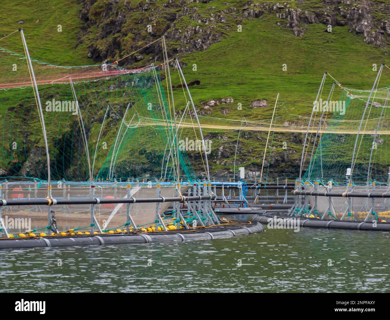 Vestmanna, Faroe Islands - July, 2021: Salmon farm, equipped with a ...