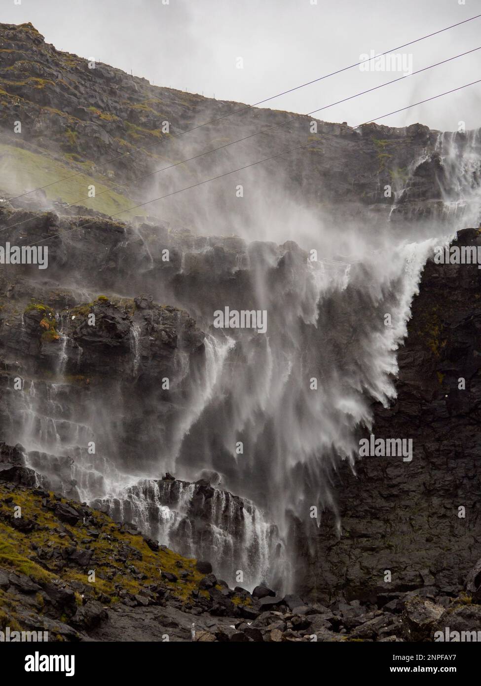 Close up for waterfall Fossa (Fossá) during strong wind in rainy ...