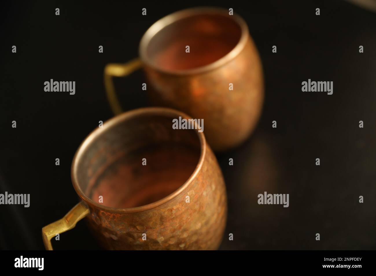 moscow mule cup holding empty golden and bronze before making a drink ...