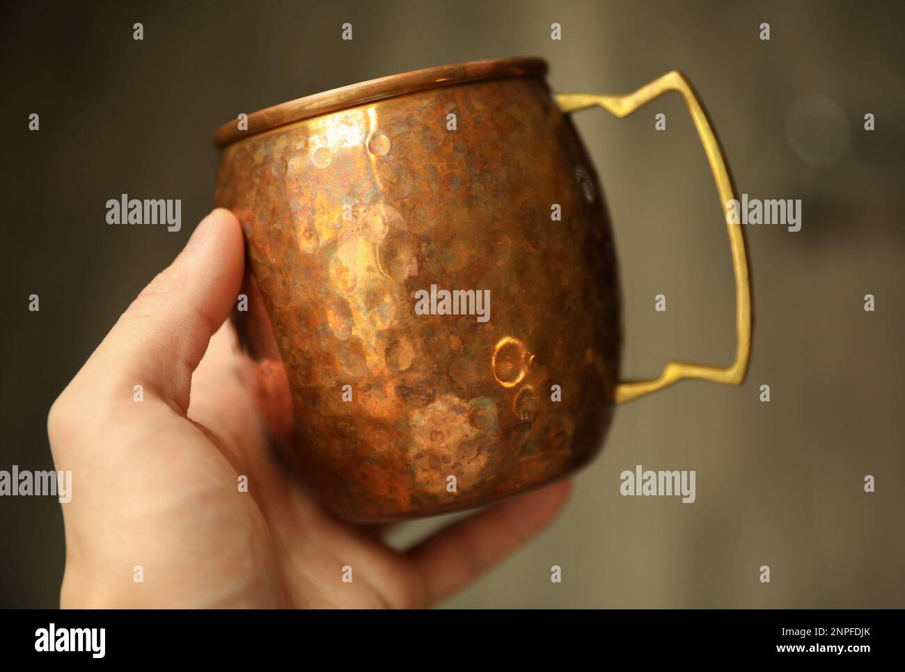 moscow mule cup holding empty golden and bronze before making a drink ...