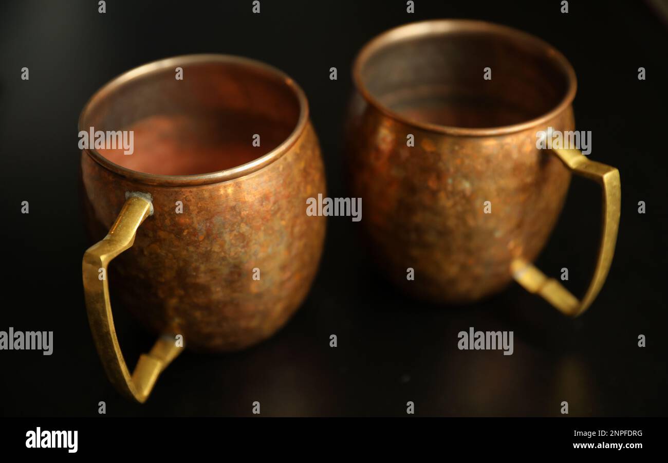 moscow mule cup holding empty golden and bronze before making a drink ...