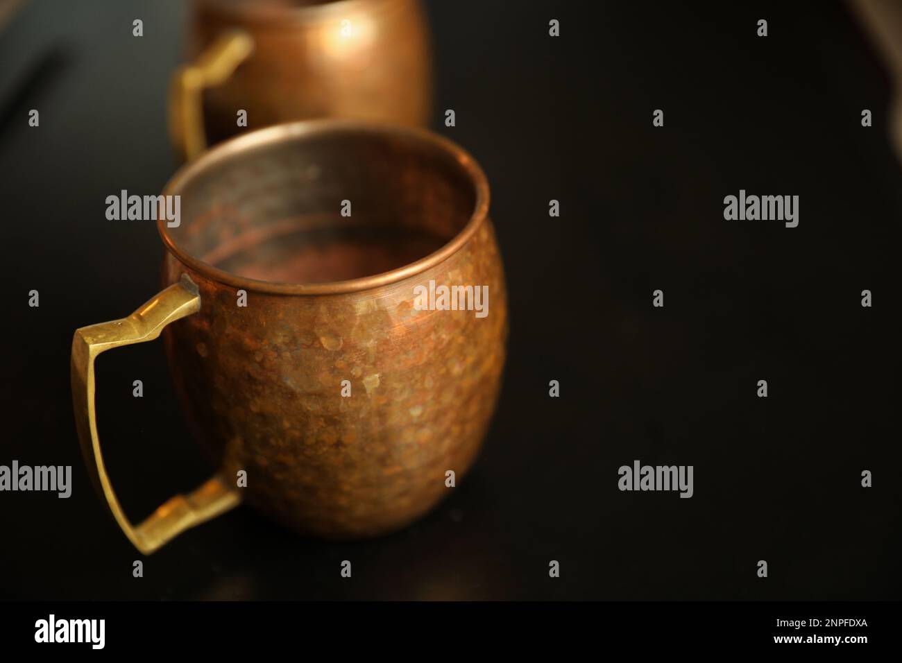 moscow mule cup holding empty golden and bronze before making a drink ...