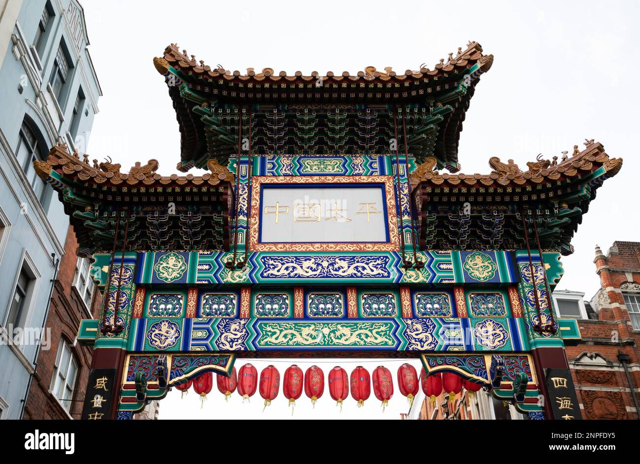 An ornate gateway to London's Chinatown is decorated with red Chinese ...