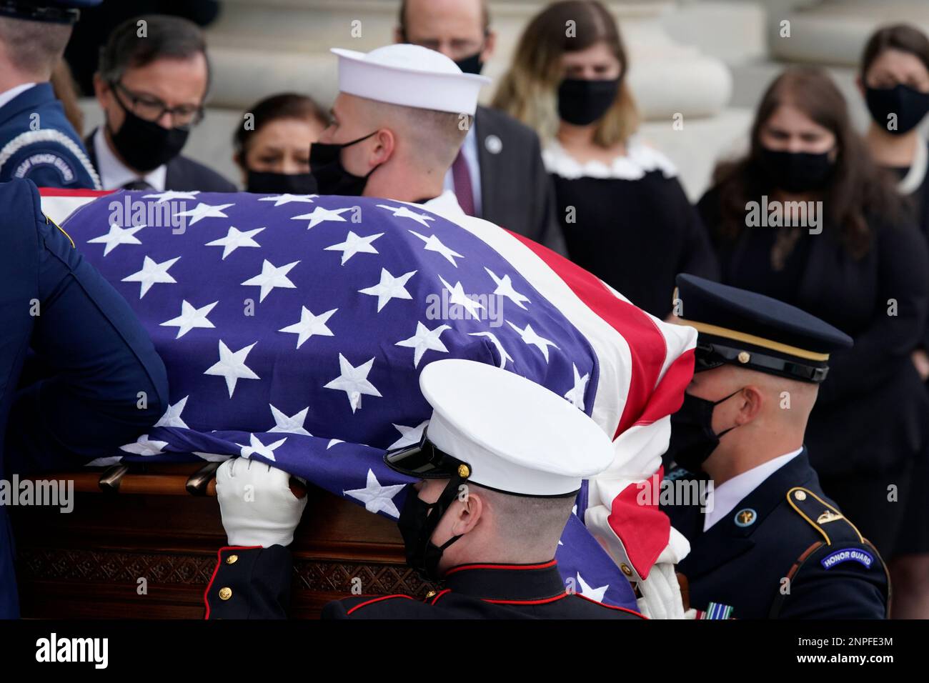 Members of the family watch as the flag-draped casket of Justice Ruth ...