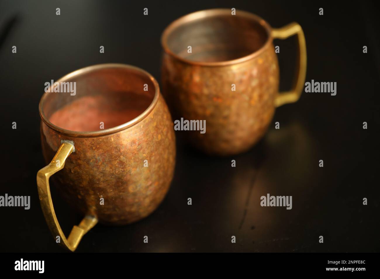 moscow mule cup holding empty golden and bronze before making a drink ...