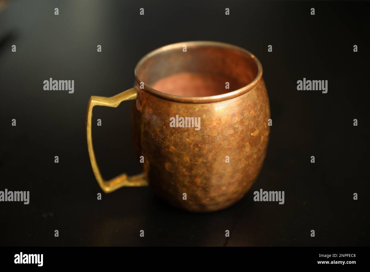 moscow mule cup holding empty golden and bronze before making a drink ...