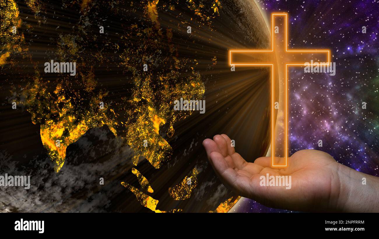 Hand holding a glowing christian cross in front of earth planet and ...