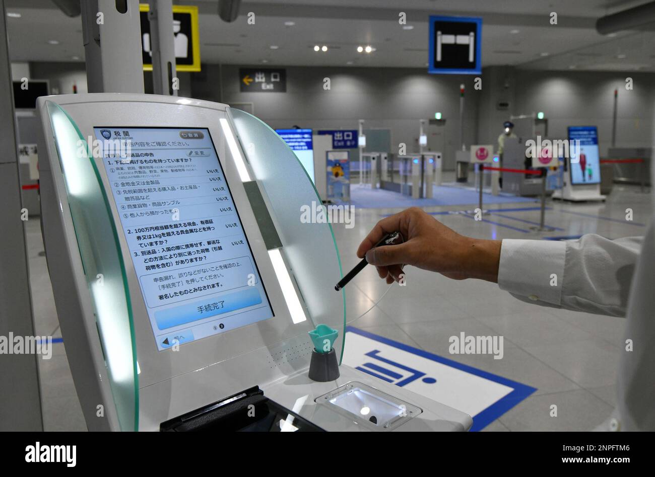 A customs officer demonstrates to use an Electronic Customs Declaration ...