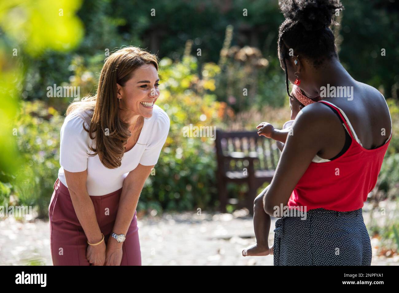 Britain's Kate, the Duchess of Cambridge, left, talks with Morgan Alex ...