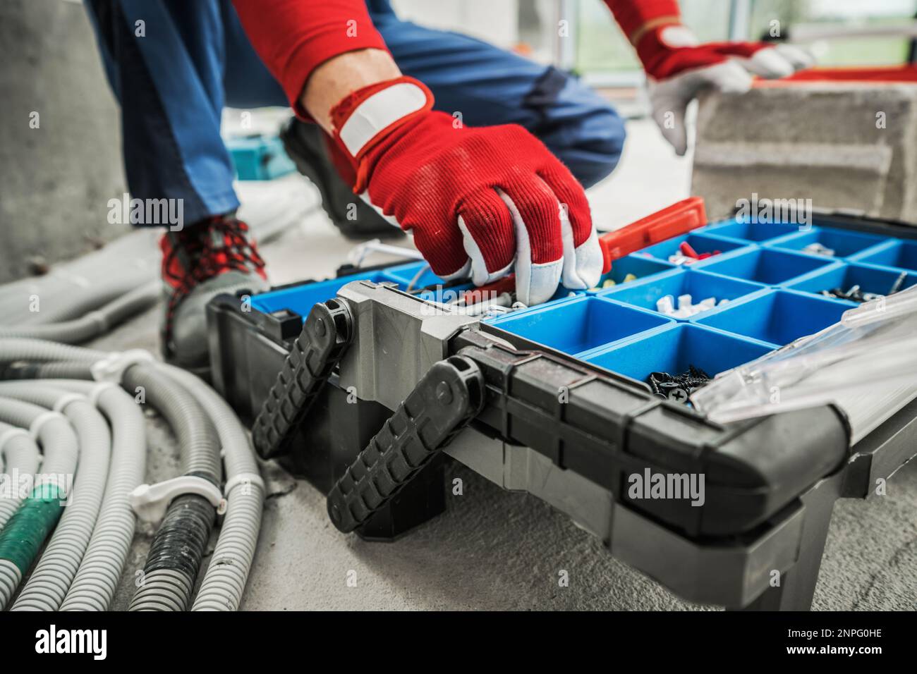 General Construction Worker Selecting Right Screw From His ToolBox ...