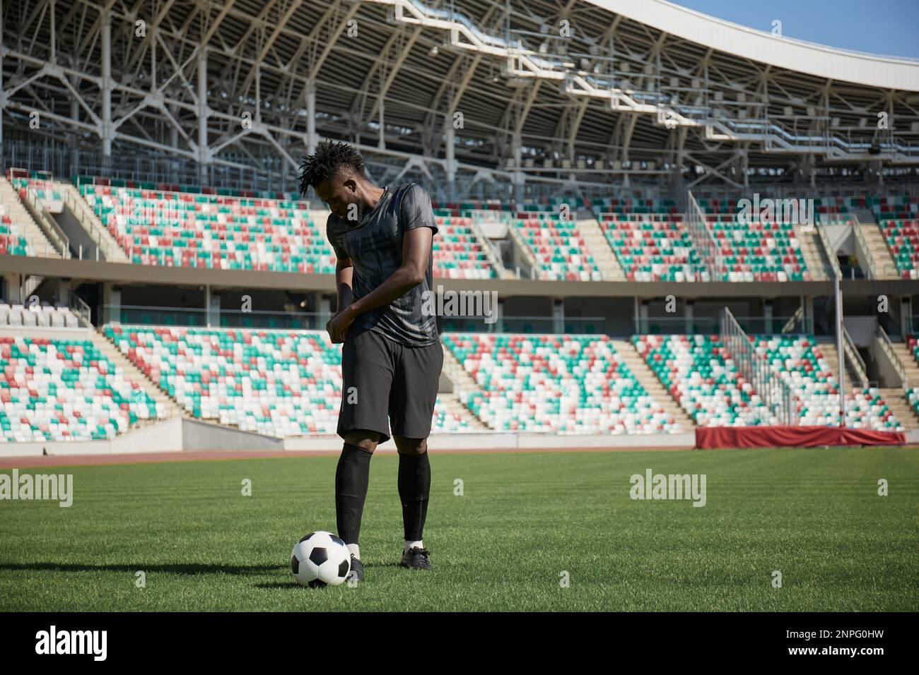 African American soccer player during match inside large stadium Stock ...