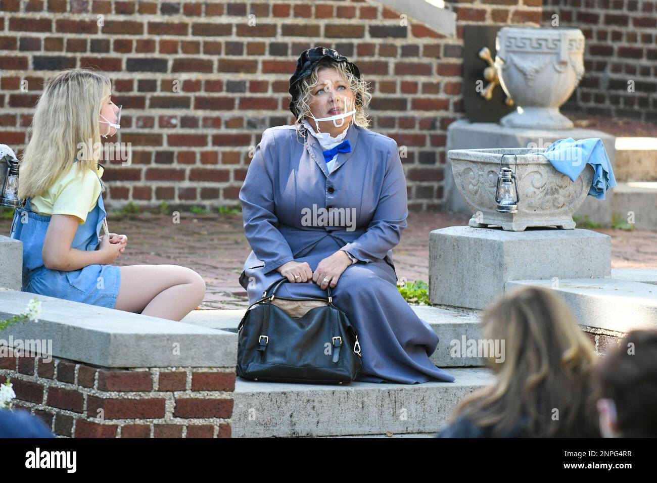 Lisa Nagele Hollenbach as Mrs. Bumbrake, center, with Ella Frantz as ...