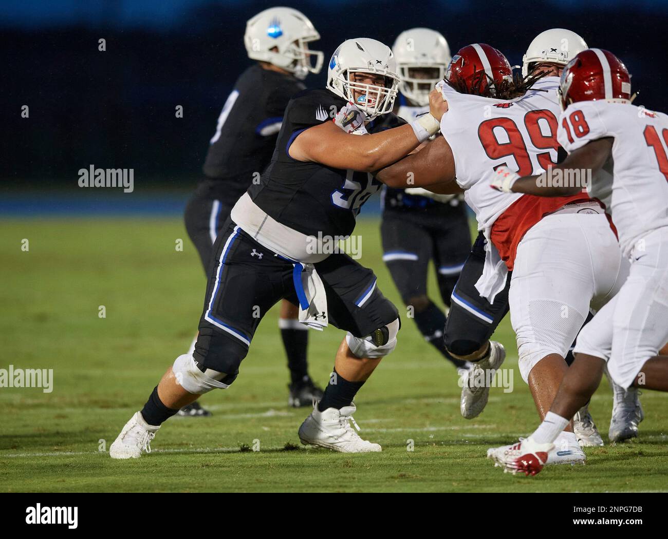 IMG Ascenders offensive lineman Ethan Lang (56) blocks defensive ...