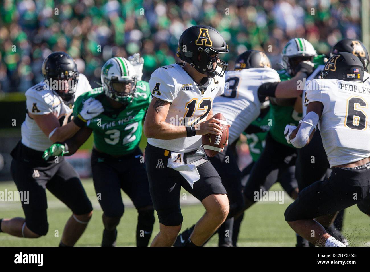 Appalachian State quarterback Zac Thomas (12) drops back to pass as ...