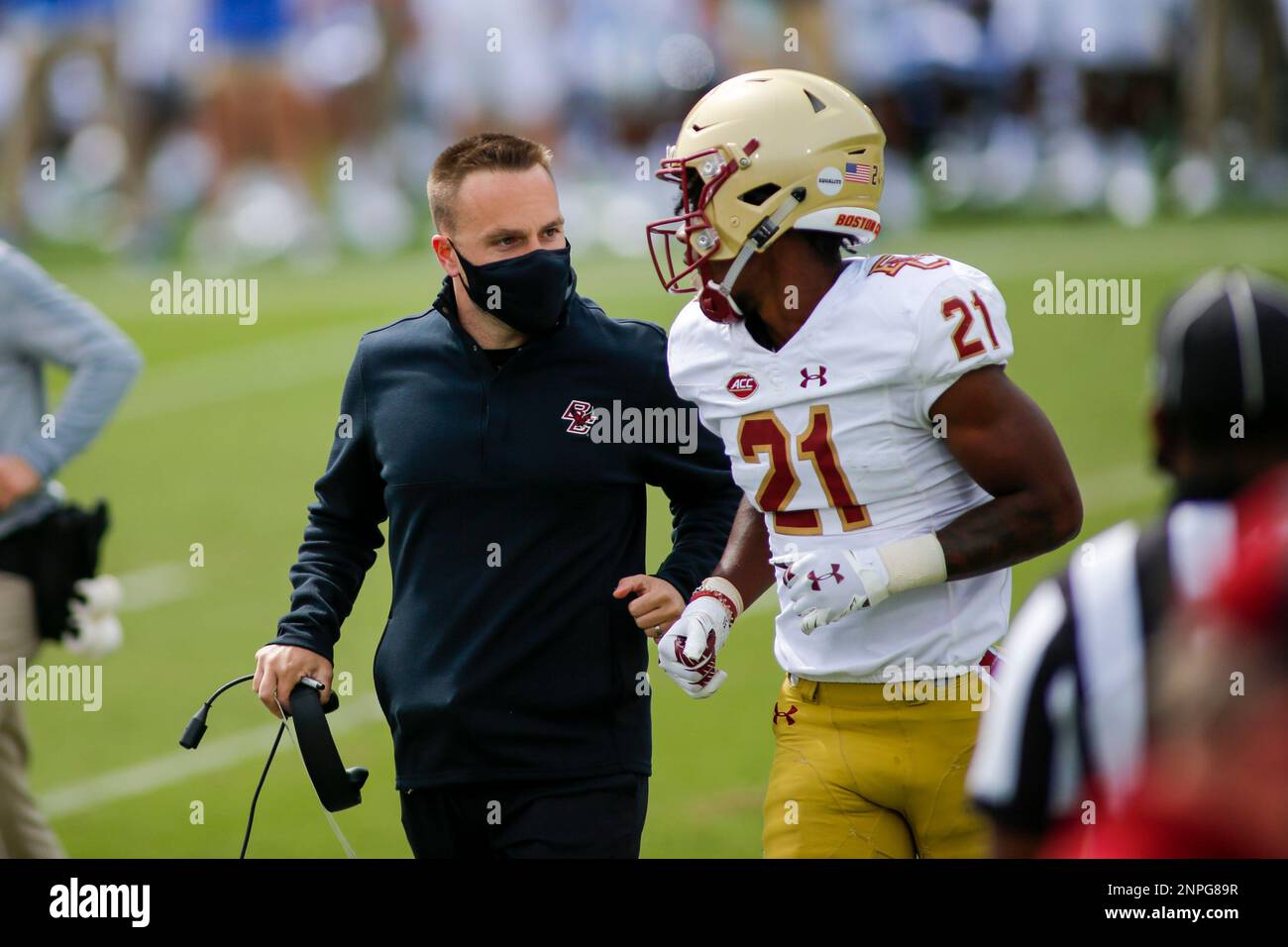 Boston College head coach Jeff Hafley, left, talks to defensive back ...