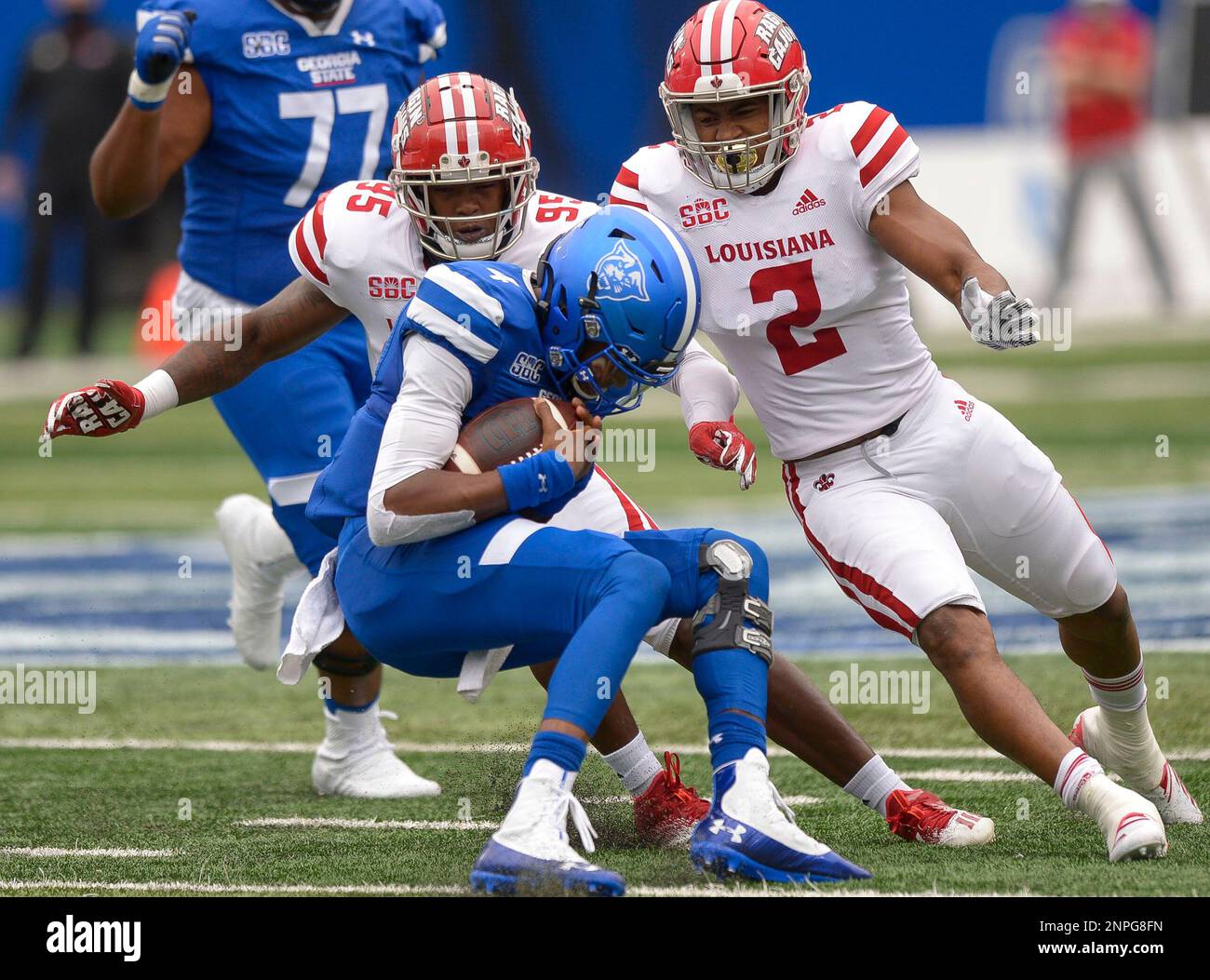 Louisiana-Lafayette linebackers Andre Riley (95) and Lorenzo McCaskill ...
