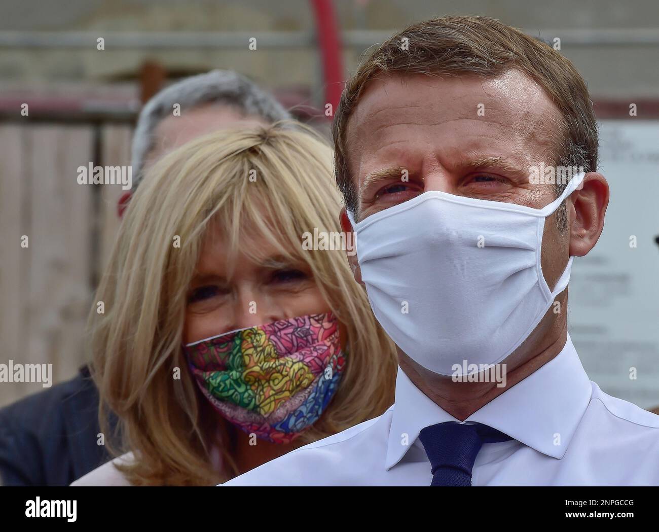 French President Emmanuel Macron and his wife Brigitte Macron wearing ...