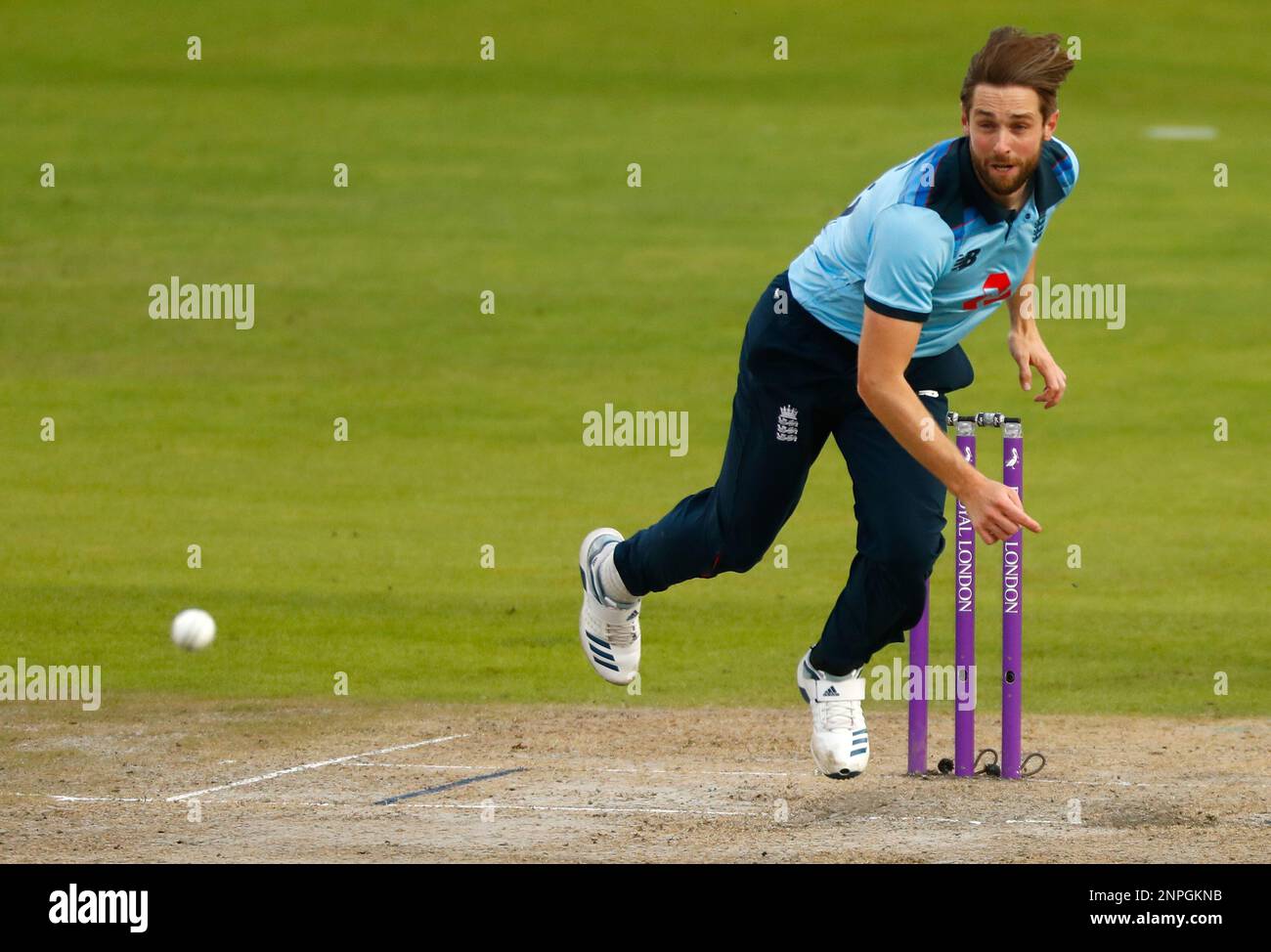 England's Chris Woakes bowls a delivery during the third ODI cricket ...