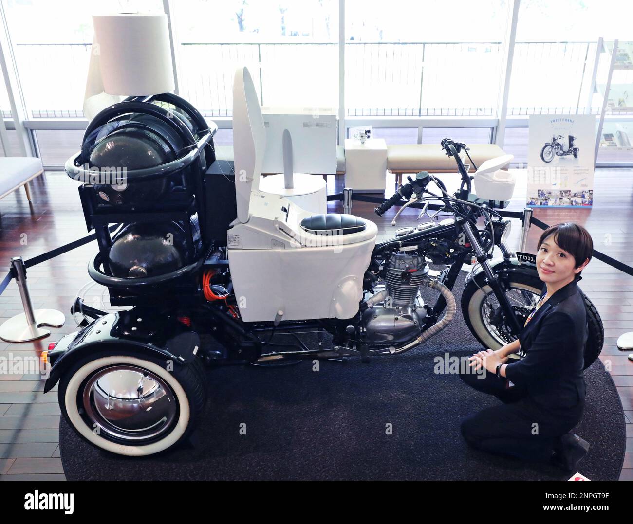 A photo shows "TOTO Toilet Bike NEO" at a museum near the headquarters ...
