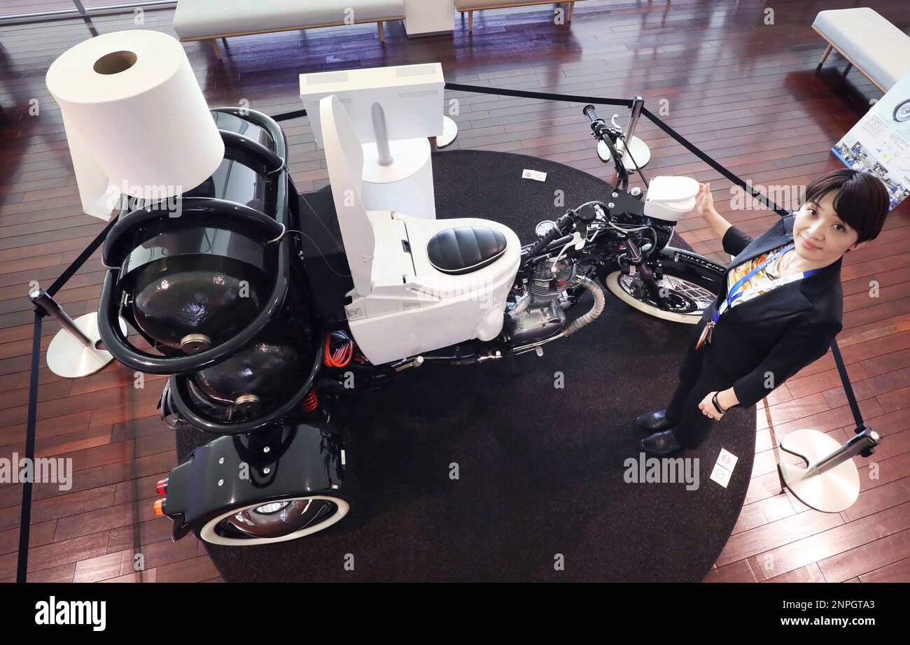 A photo shows "TOTO Toilet Bike NEO" at a museum near the headquarters ...