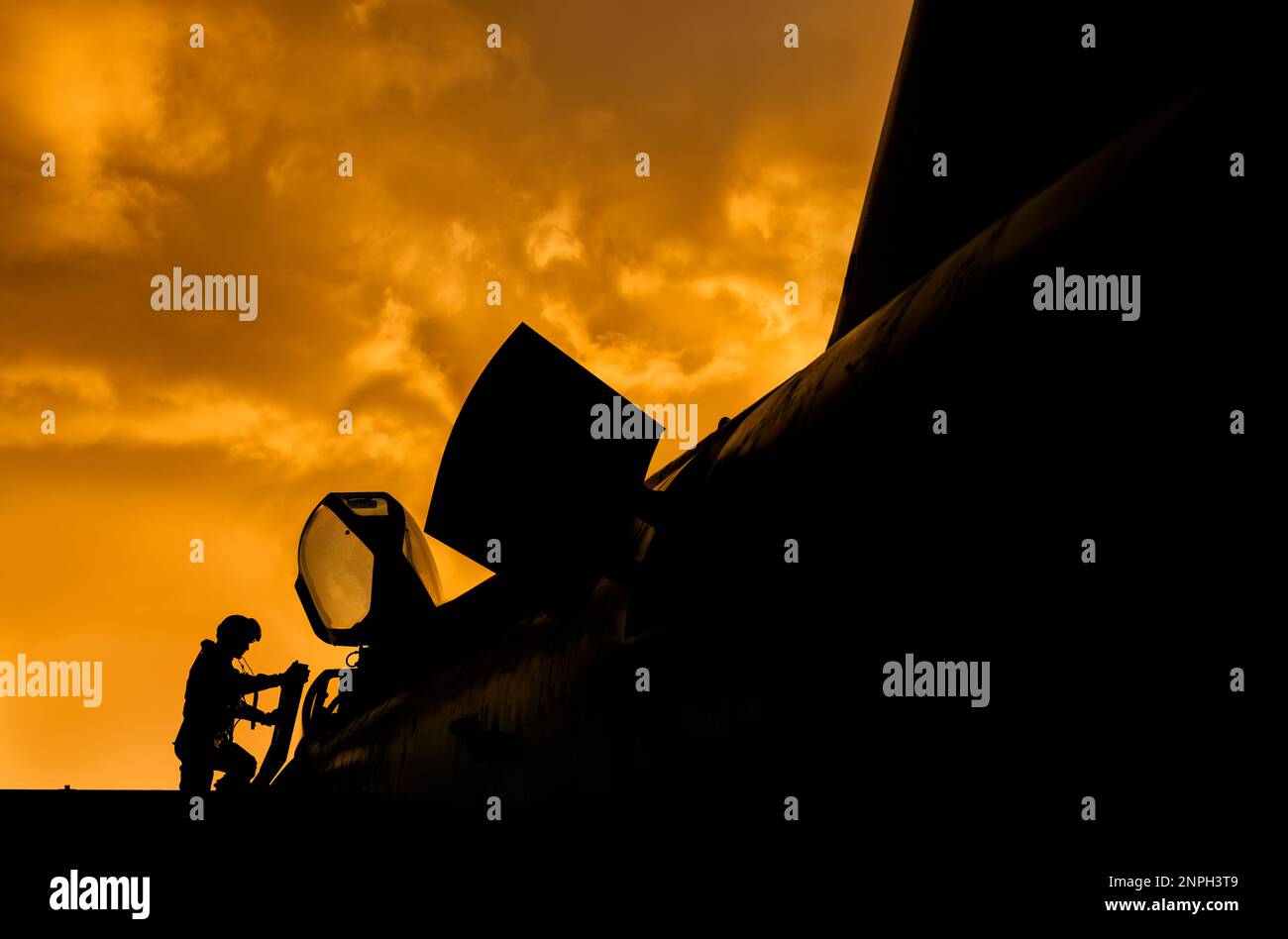 Fighter pilot climbs on board his jet fighter interceptor for a combat ...