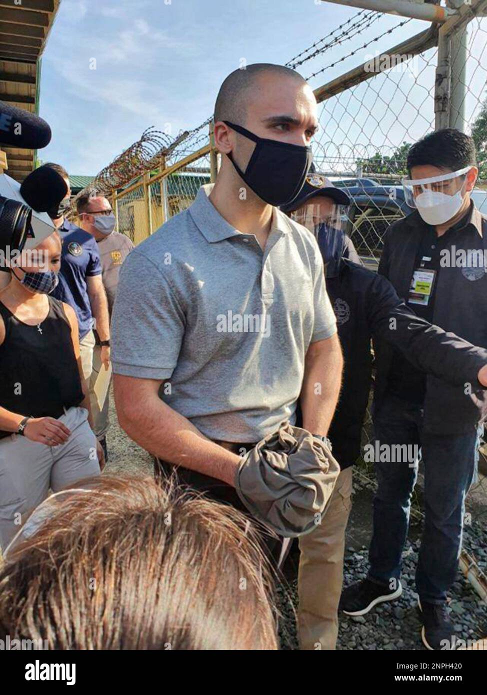 In this photo provided by the Philippines' Bureau of Immigration, U.S ...