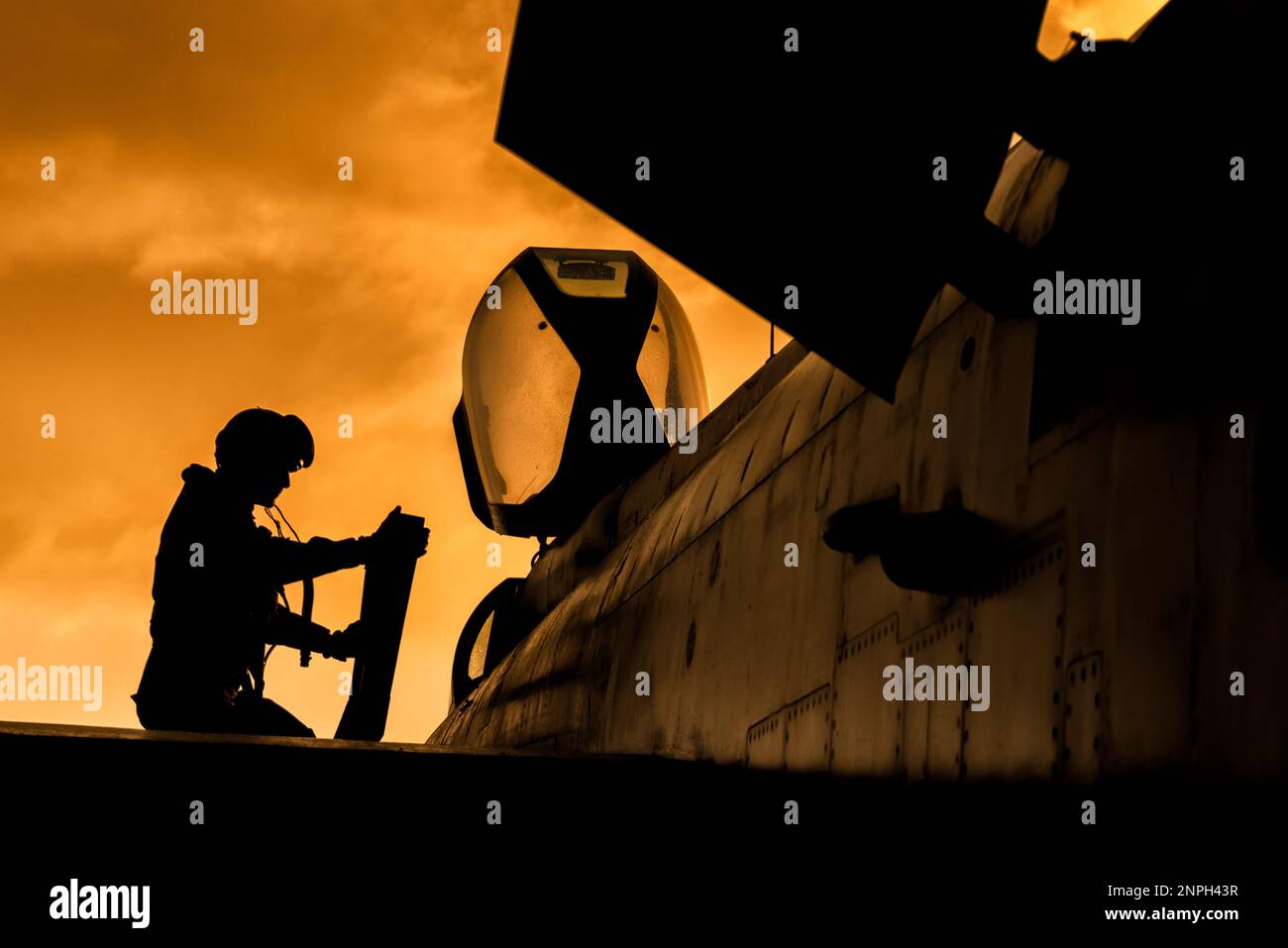 Fighter pilot climbs on board his jet fighter interceptor for a combat ...