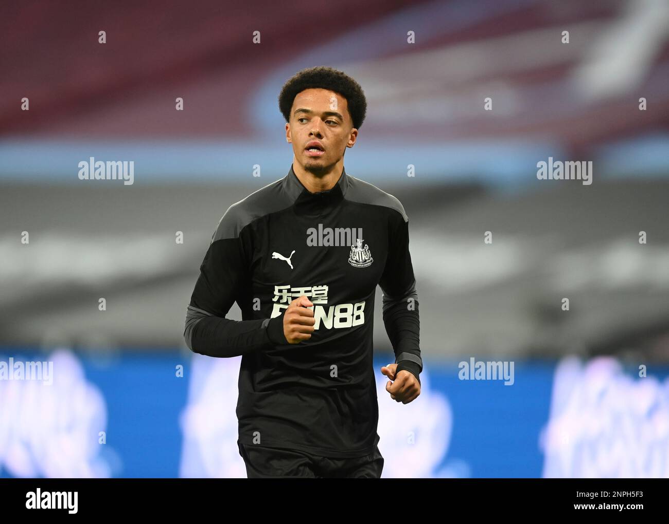 Newcastle's Jamal Lewis runs during warm up before the English Premier ...
